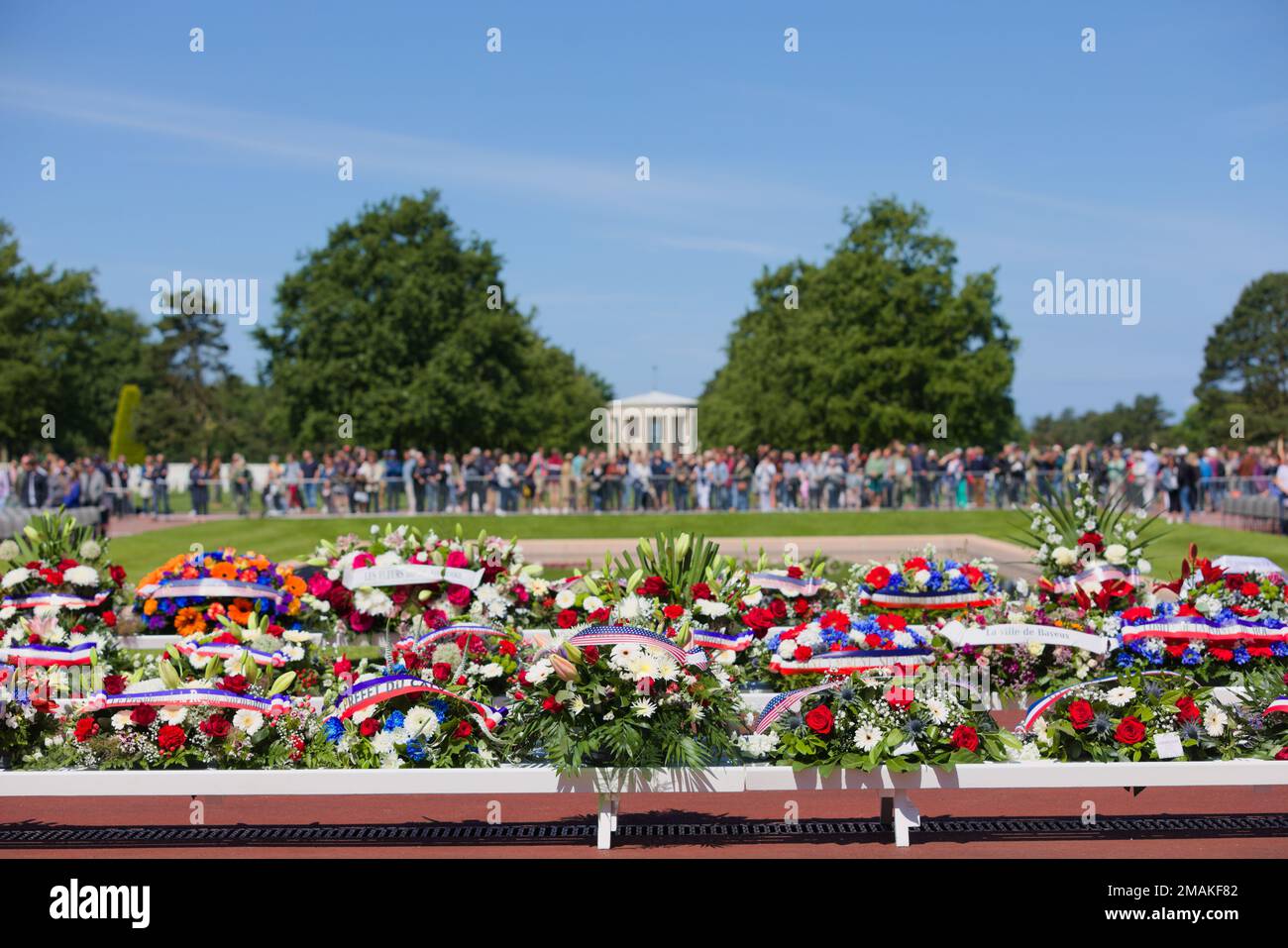 Guests observe a ceremony honoring the fallen soldiers and service ...