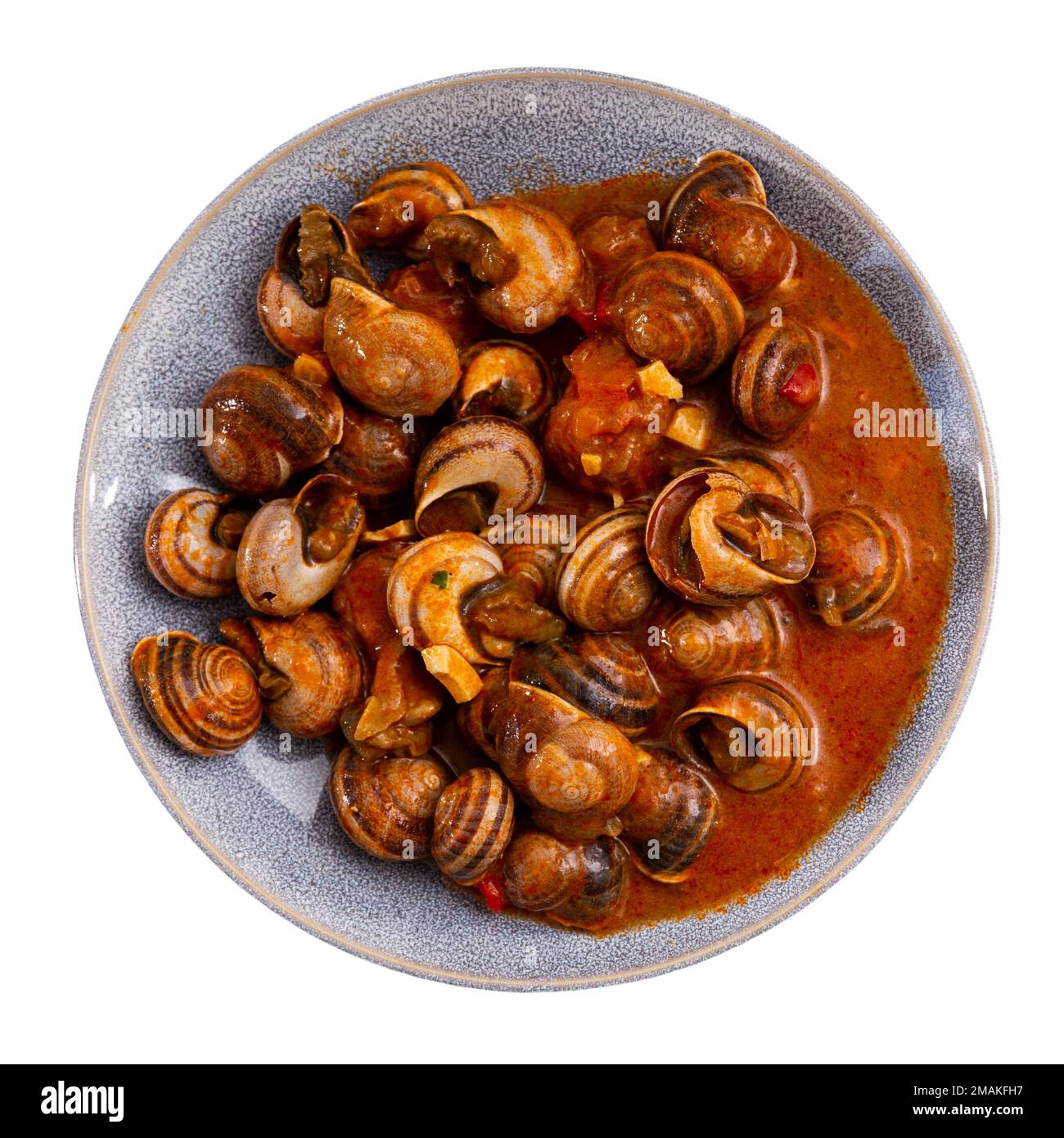 Roasted snails in the tomato sauce on a plate Stock Photo - Alamy