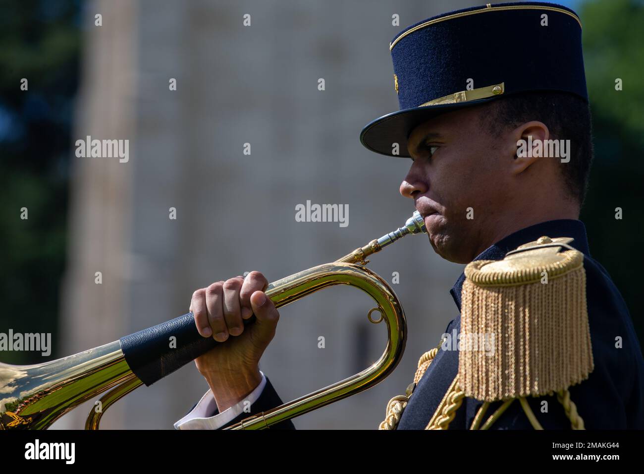 A French Soldier plays a bugle during a ceremony at Aisne-Marne ...