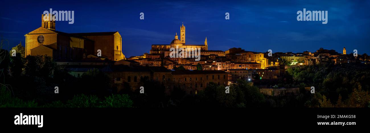 Night, panoramic view of Siena, a medieval town on a hilltop in Tuscany ...
