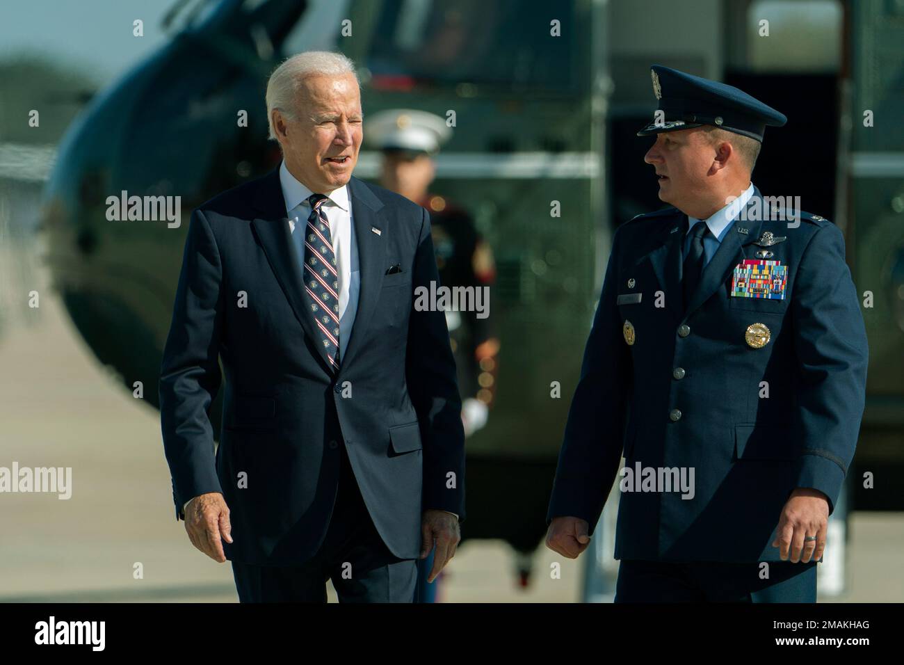 President Joe Biden walks with Col. Matthew Jones, Commander of the ...