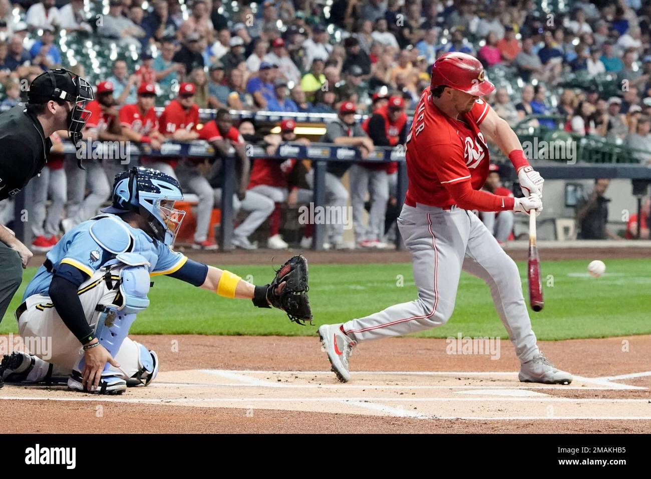 Cincinnati Reds' Kyle Farmer hits an RBI single during the first inning ...