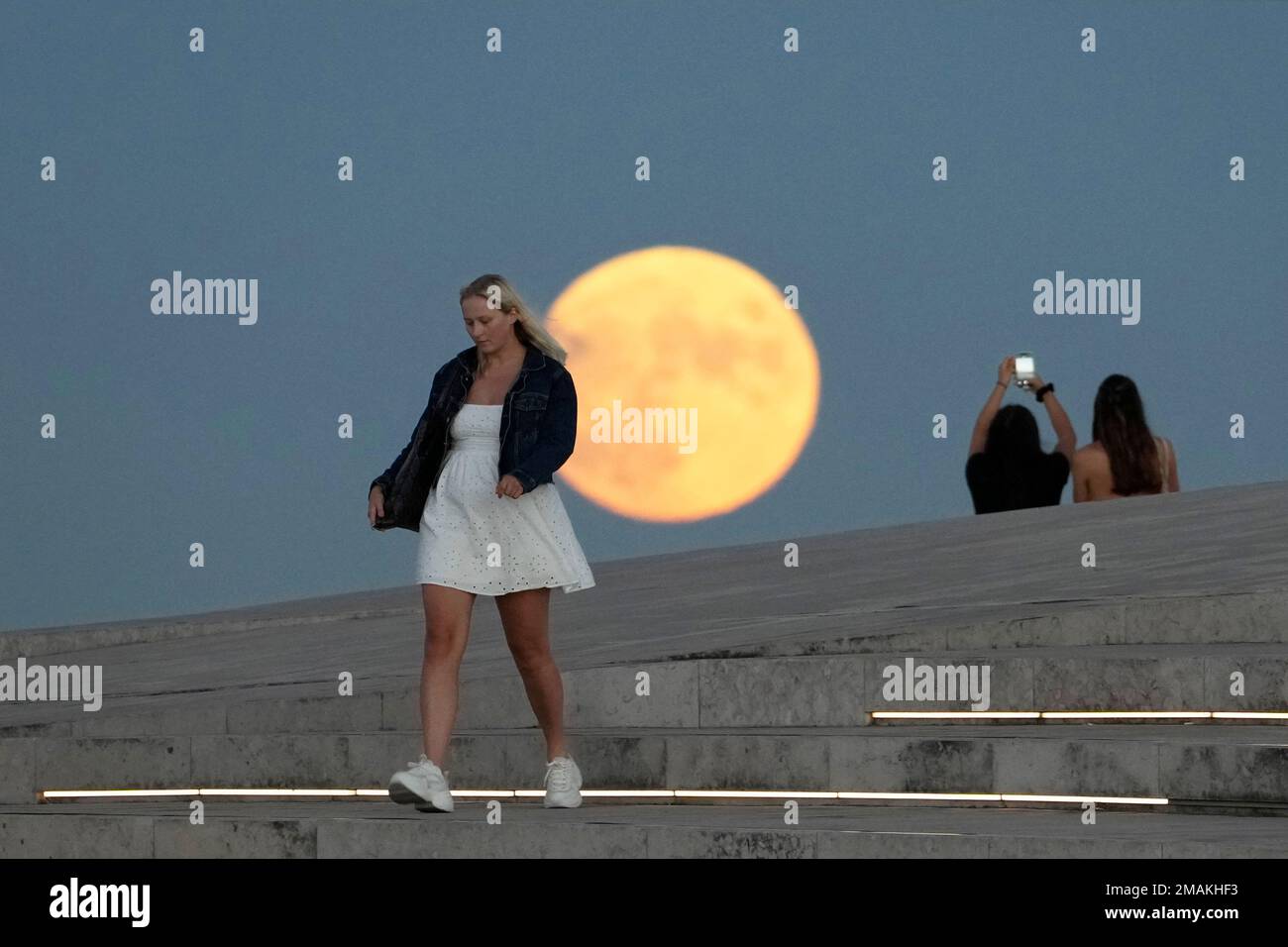 A woman walks down the roof of the Museum of Art, Architecture and ...