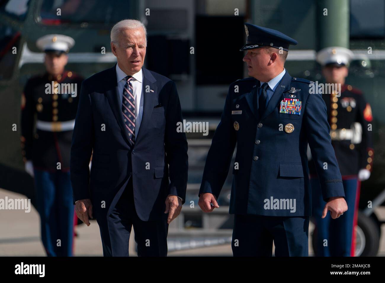 President Joe Biden walks Col. Matthew Jones, Commander of the 89th ...