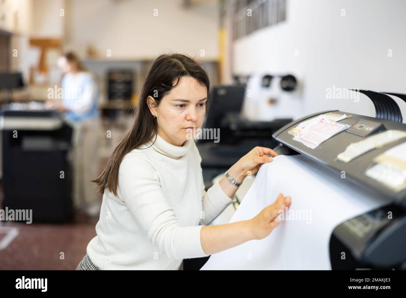 Employee using modern printer hi-res stock photography and images - Alamy