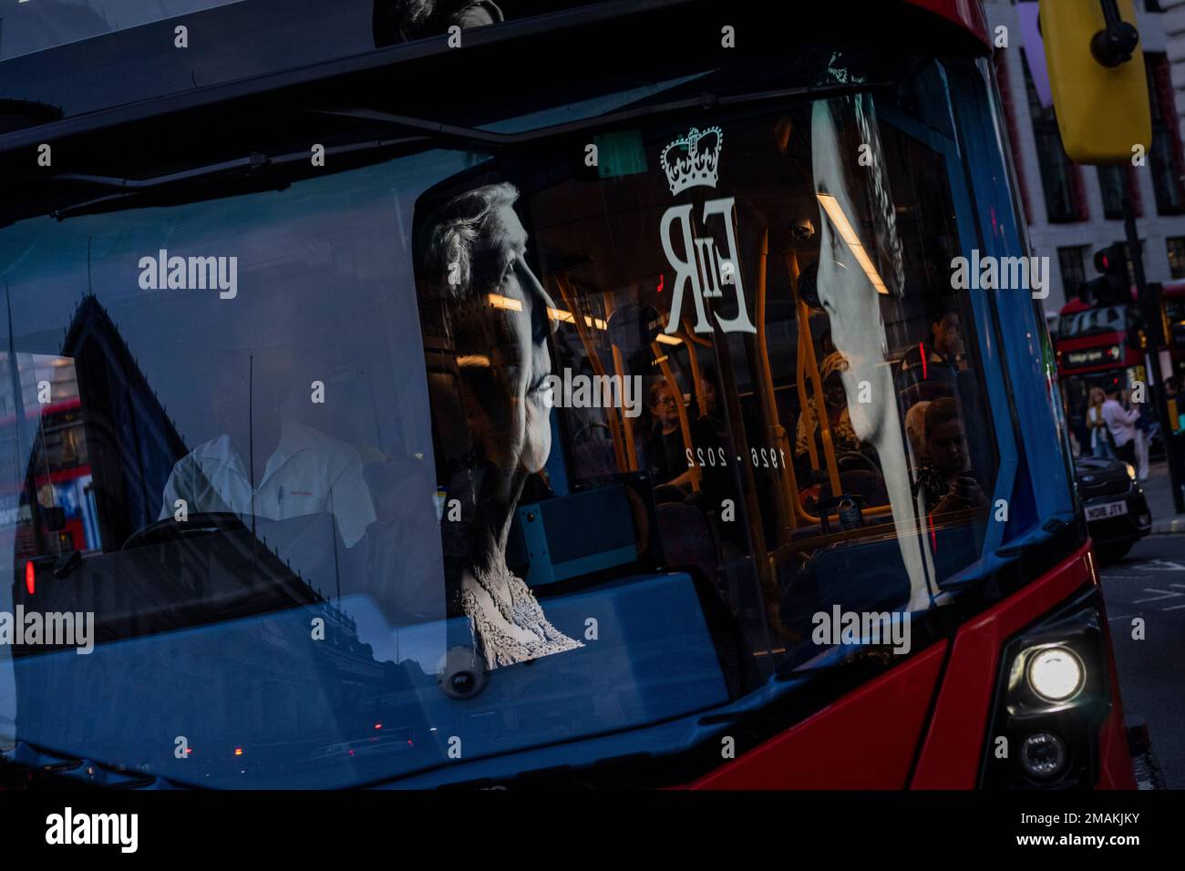 A tribute to the Queen is reflected on a bus at Piccadilly Circus in ...