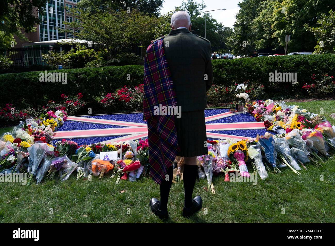 Gary Gillespie pauses at the flower memorial outside the British ...