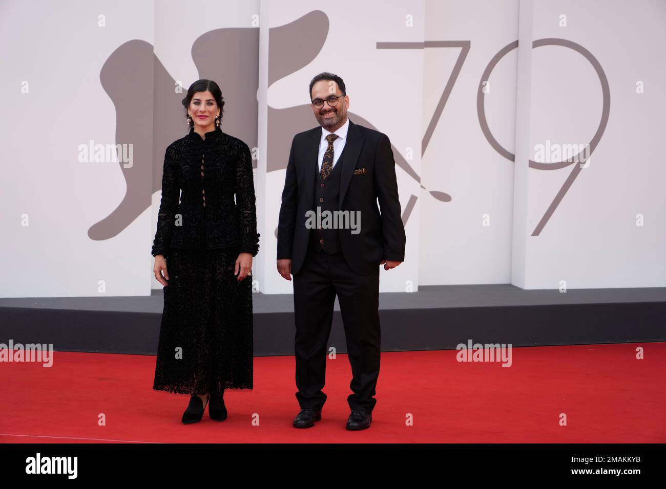 Mina Kavani, left, and Reza Heydari pose for photographers upon arrival ...