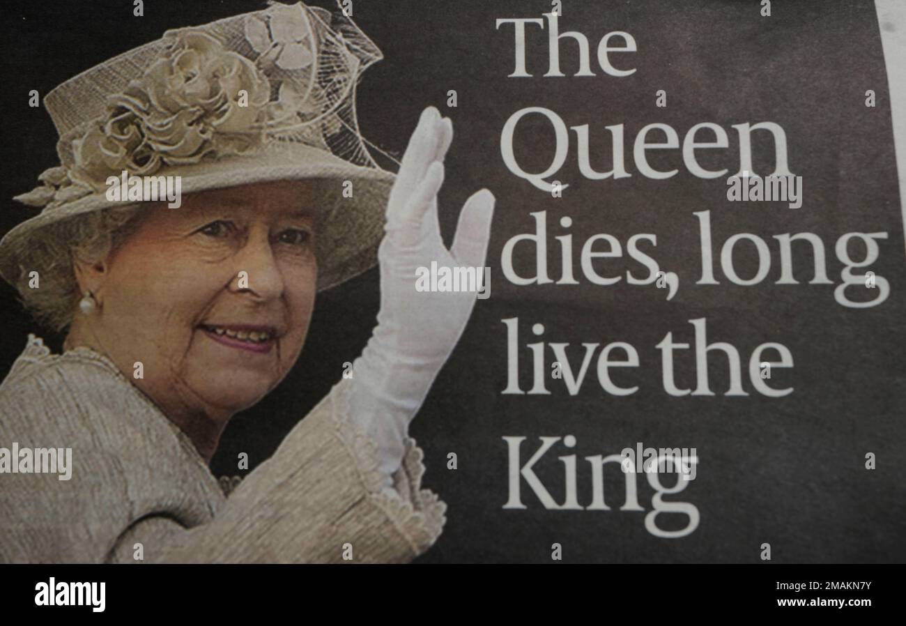 A newspaper with a front page photo of Britain's Queen Elizabeth II at ...
