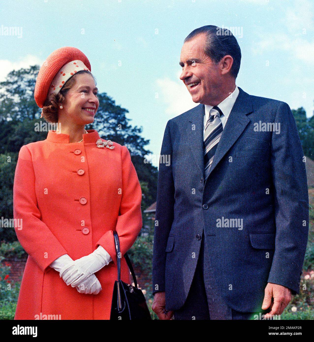 FILE - In this 1970 photo, Queen Elizabeth II, left, reacts with U.S ...