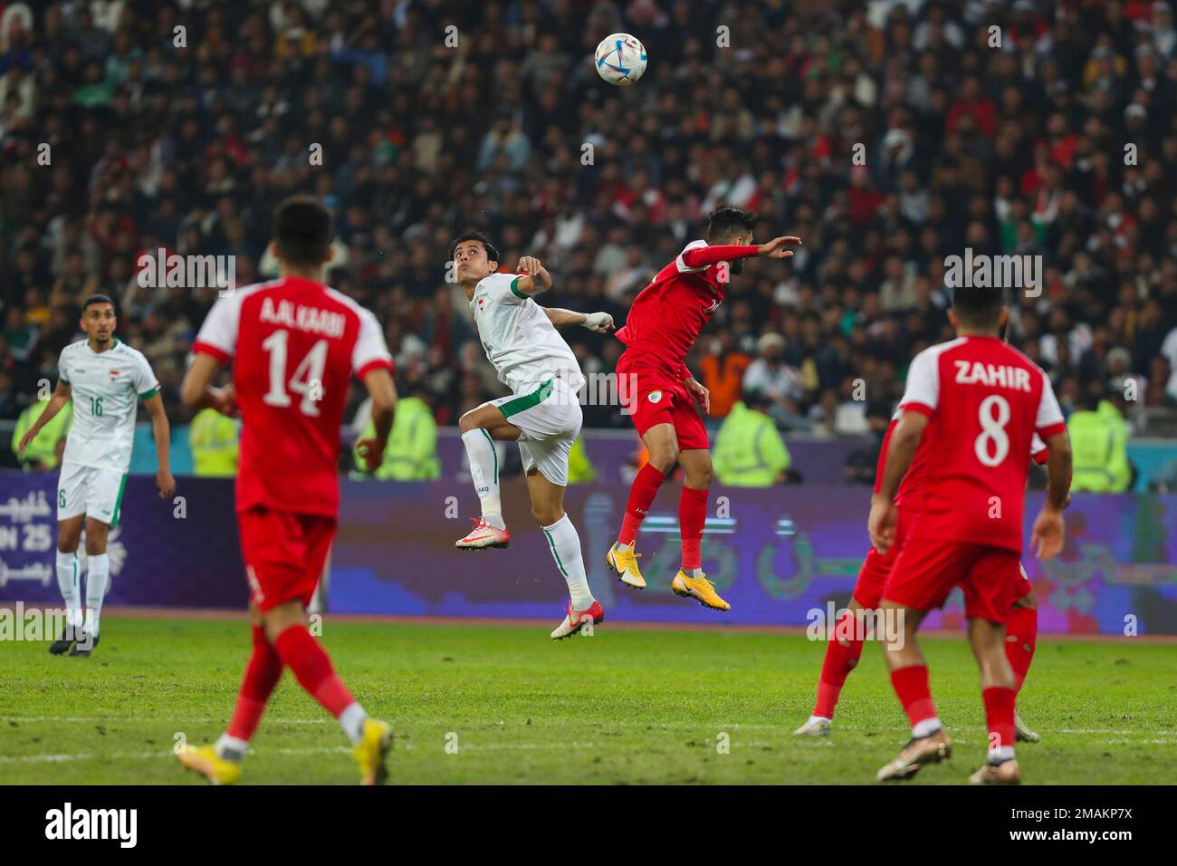Iraq's Ibrahim Bayesh, center, fights for the ball, during the Arabian ...