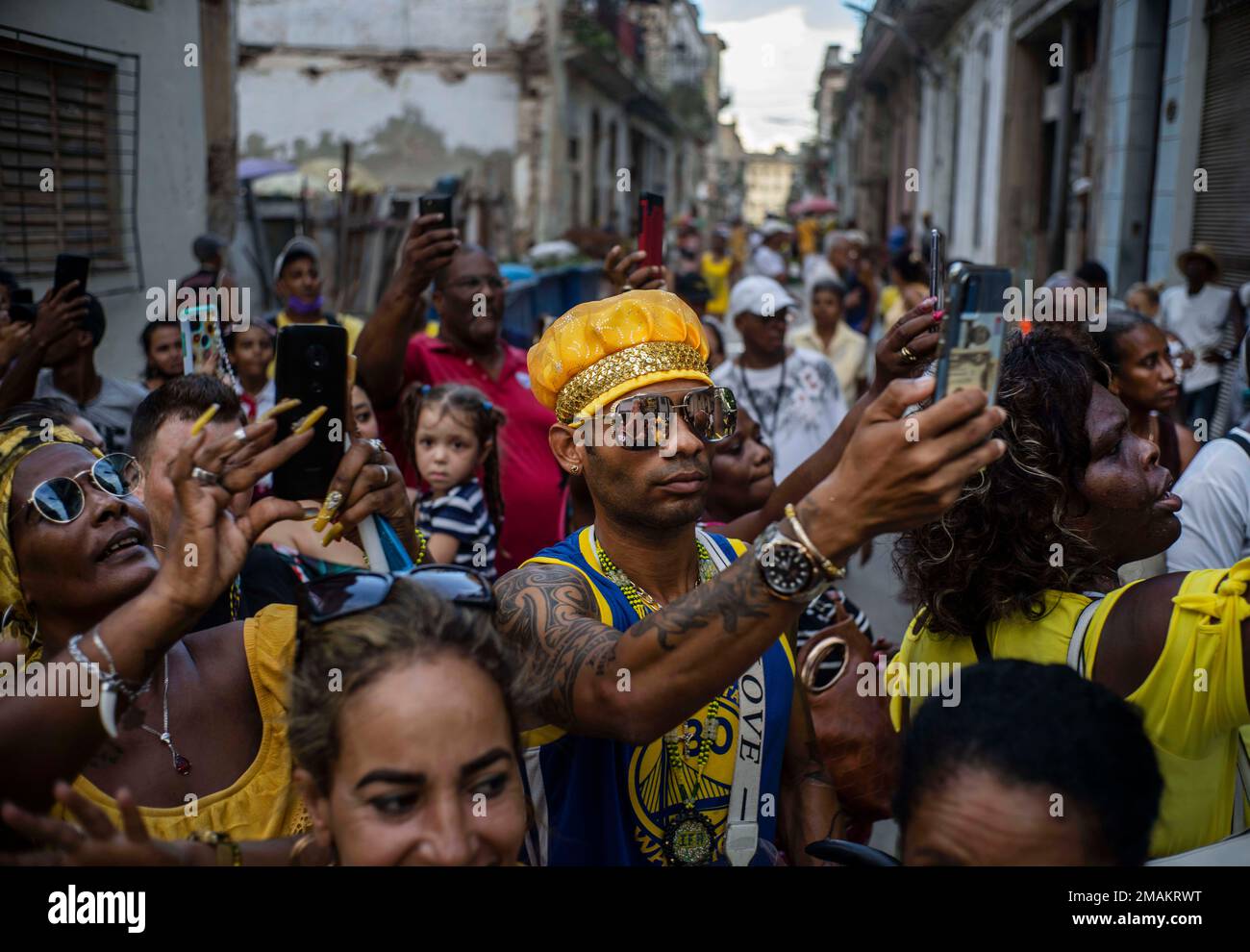 Faithful watch the procession honoring the Virgen de la Caridad del ...