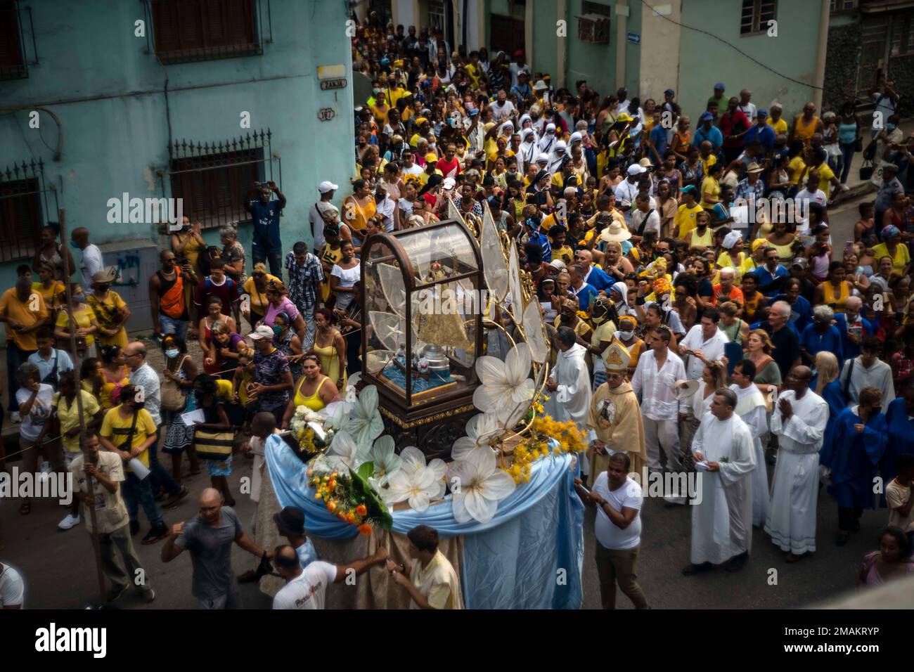 People carry a statue of the Virgen de la Caridad del Cobre, on her ...