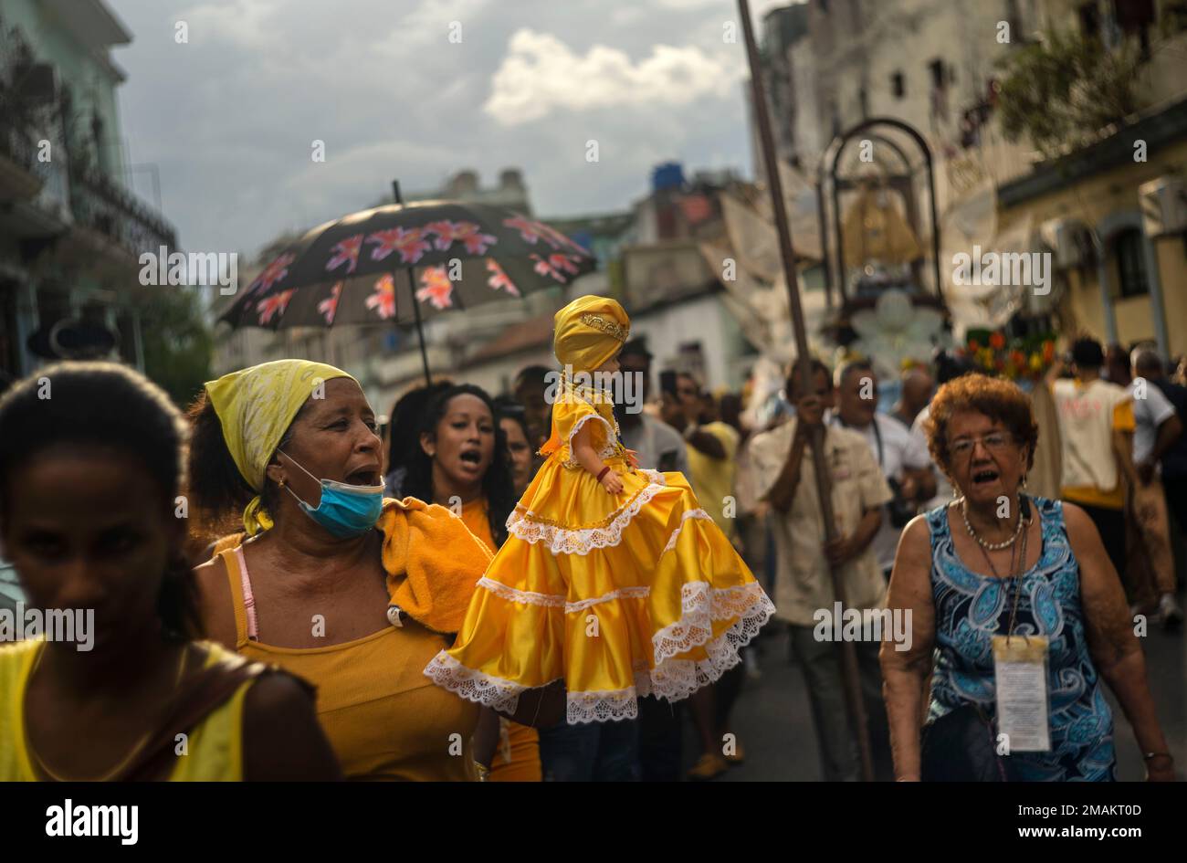 Faithful watch the procession honoring the Virgen de la Caridad del ...