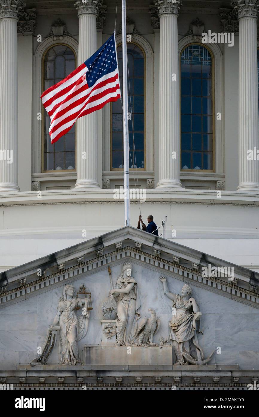The U.S. flag is lowered to half-staff at the U.S. Capitol, Thursday ...