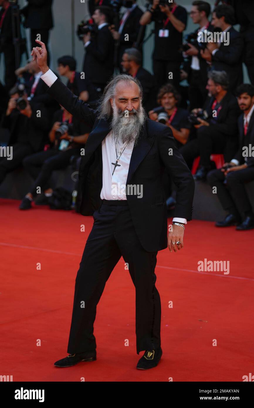 Warren Ellis poses for photographers upon arrival at the premiere of ...