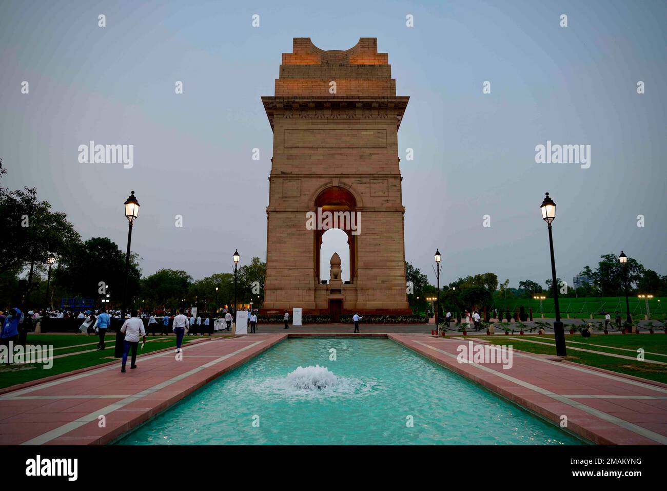 People walk by the landmark India Gate at the revamped Central Vista ...