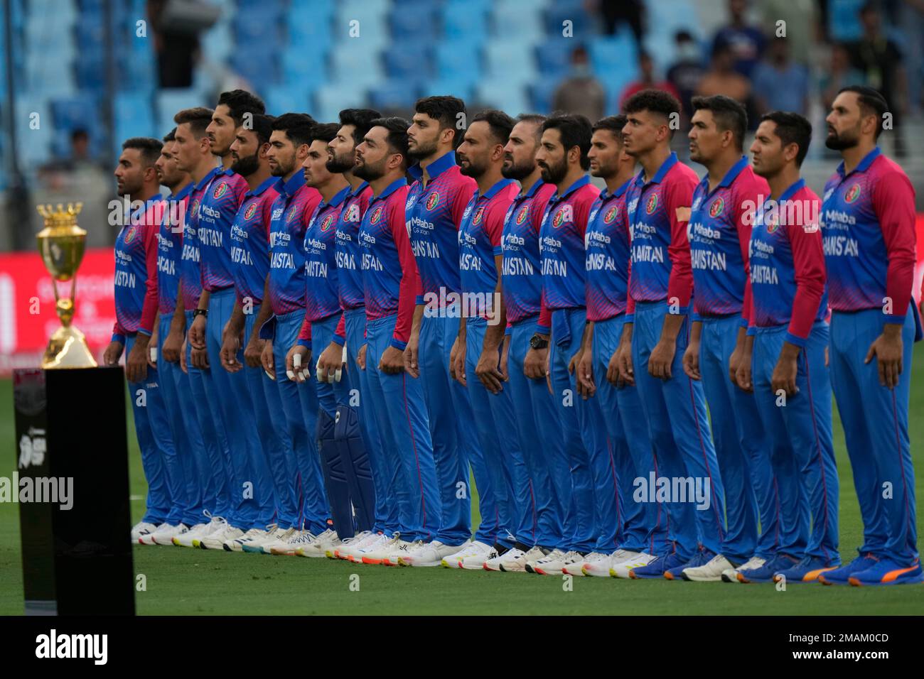 Afghanistan players stand for their national anthem before the start of ...
