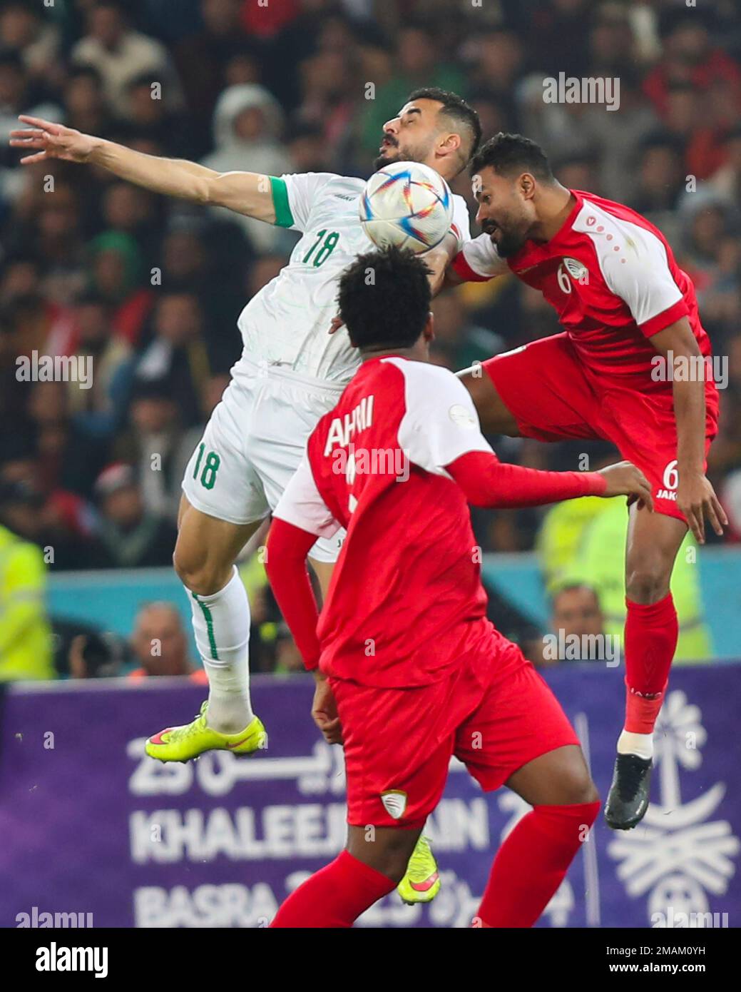 Iraq's Ayman Hussein, center, fights for the ball, during the Arabian ...