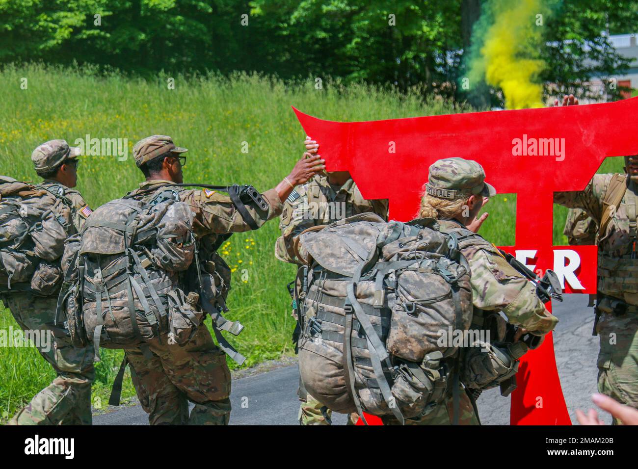 Cadets with the United States Military Academy tap the symbol of 1st ...