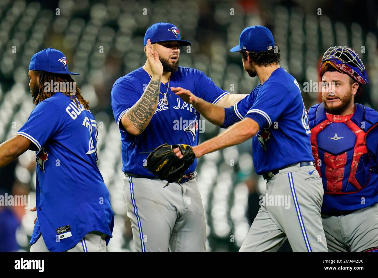 Toronto Blue Jays starting pitcher Alek Manoah, center, celebrates with ...