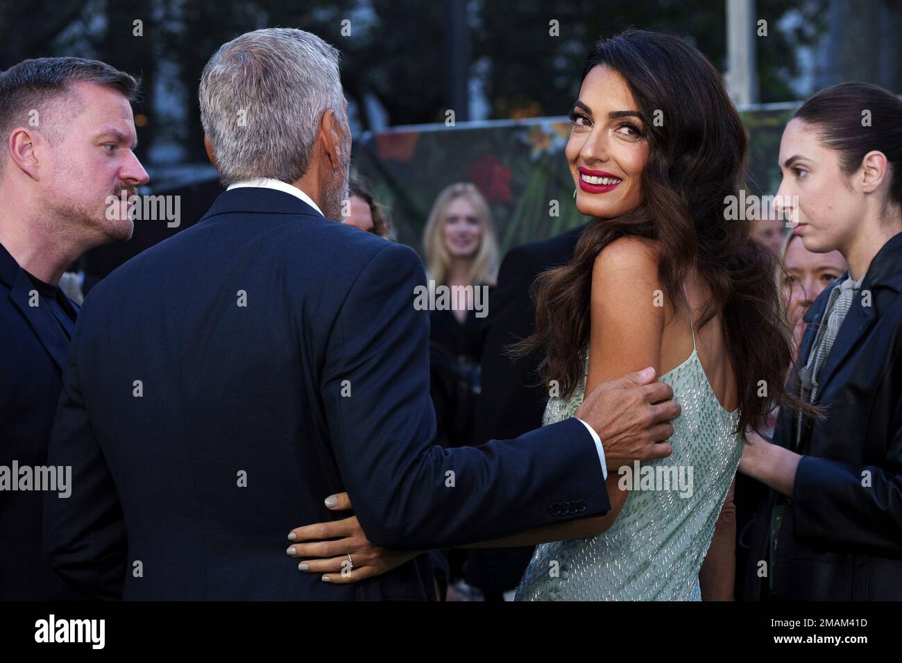 Amal Clooney, left, and George Clooney pose for photographers upon ...