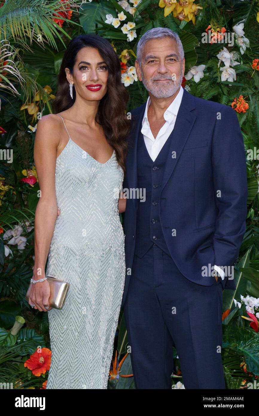 Amal Clooney, left, and George Clooney pose for photographers upon ...
