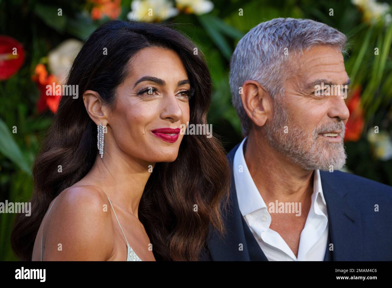 Amal Clooney, left, and George Clooney pose for photographers upon ...