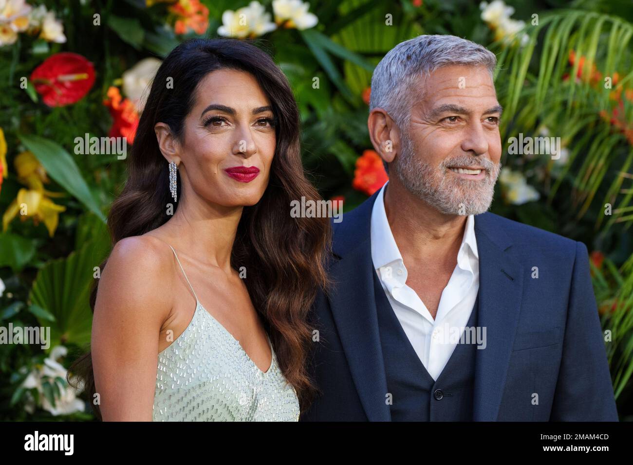 Amal Clooney, left, and George Clooney pose for photographers upon ...