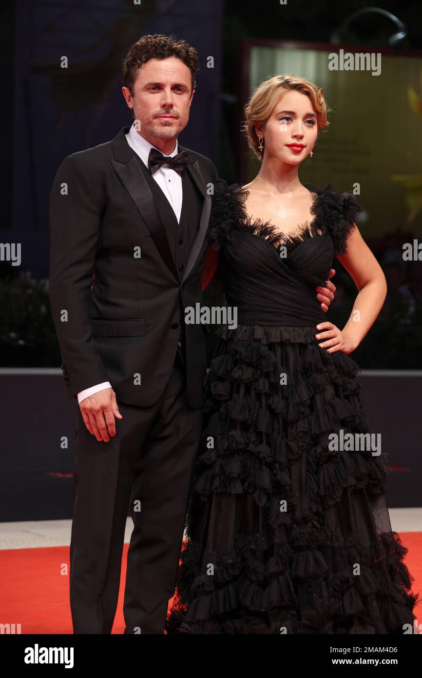 Casey Affleck, left, and Caylee Cowan pose for photographers upon ...