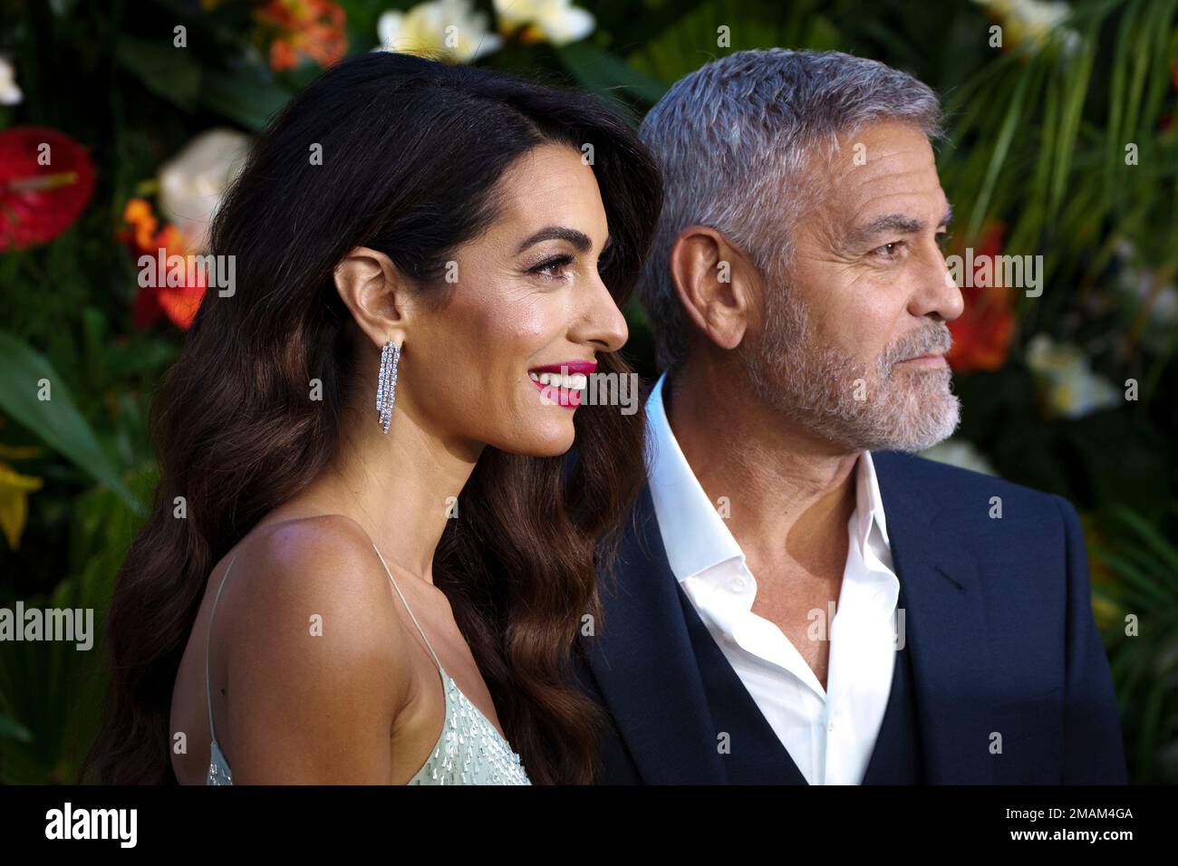 Amal Clooney, left, and George Clooney pose for photographers upon ...