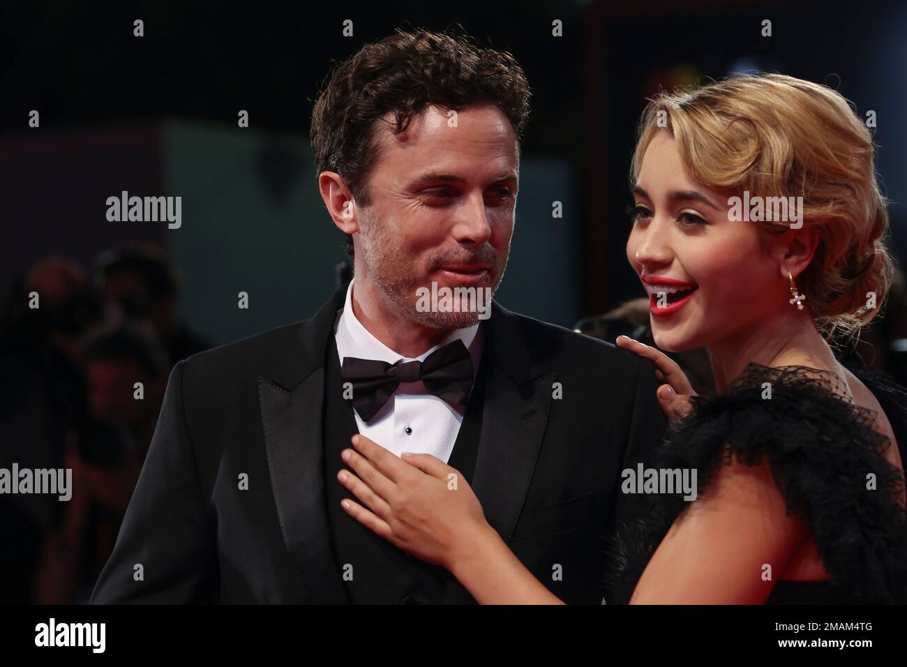 Casey Affleck, left, and Caylee Cowan pose for photographers upon ...