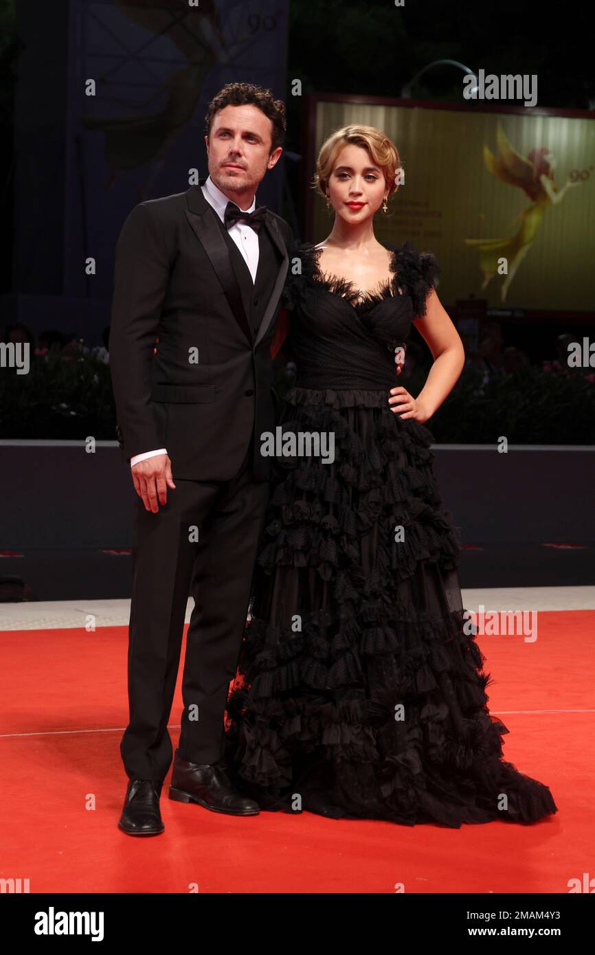 Casey Affleck, left, and Caylee Cowan pose for photographers upon ...