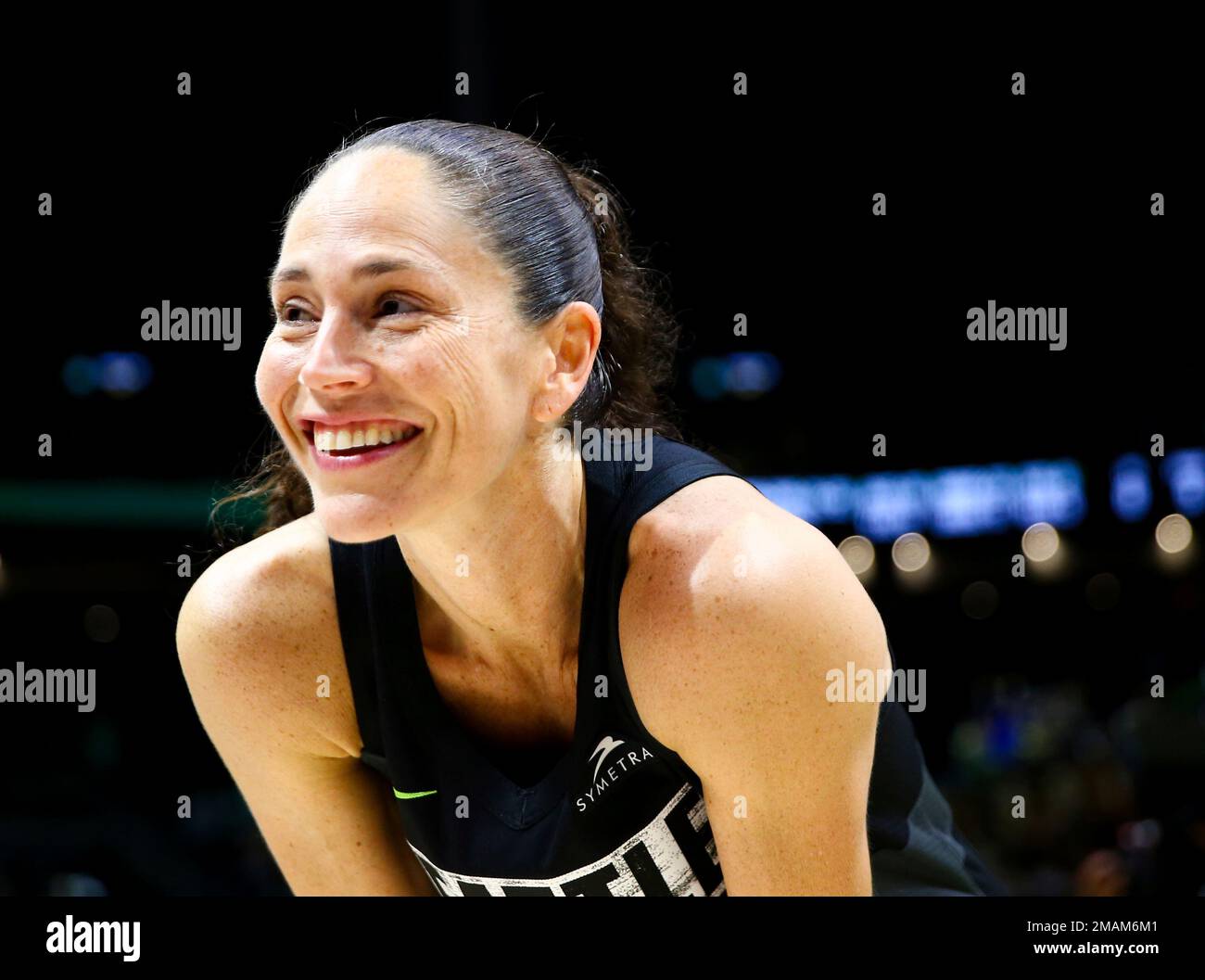 Seattle Storm guard Sue Bird leans down and smiles after playing her ...