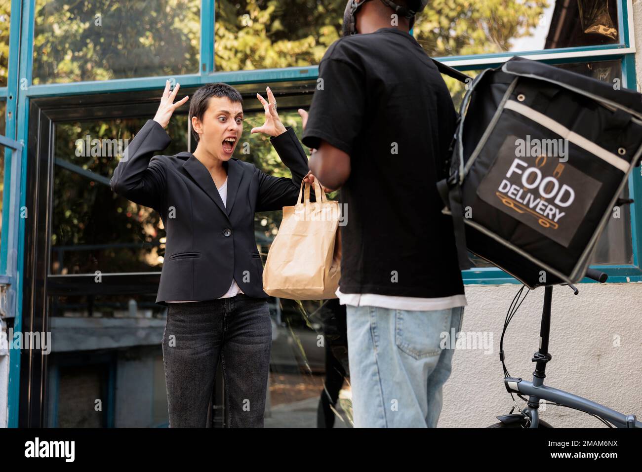 Angry customer shouting at food delivery service courier, problem with ...