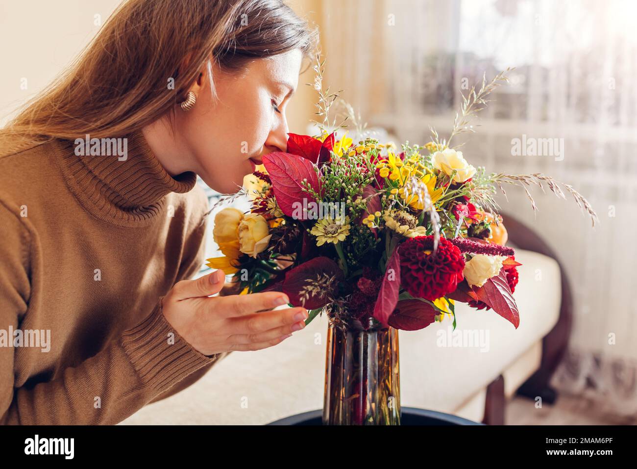 Woman smells fall bouquet hi-res stock photography and images - Alamy