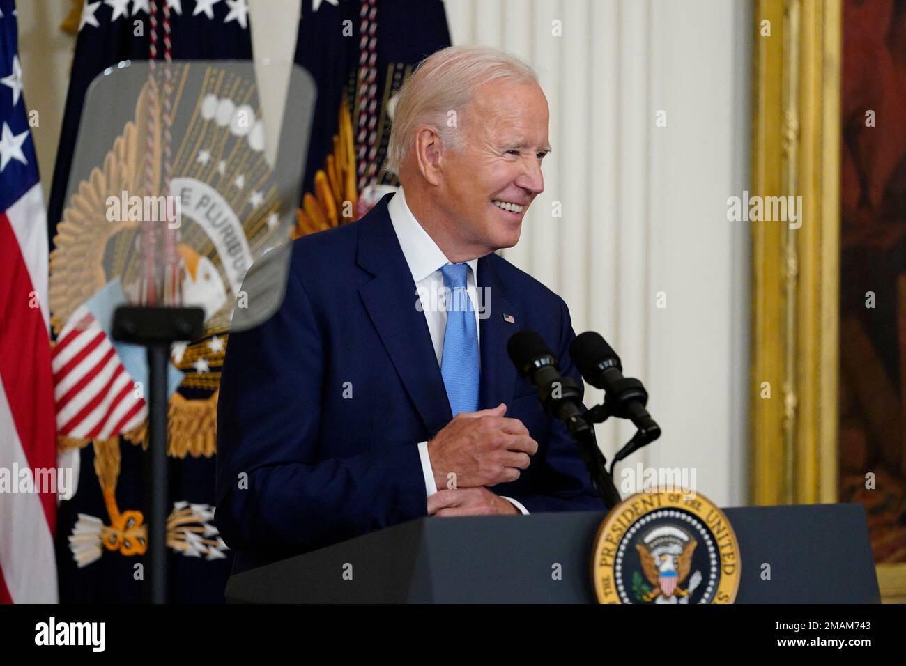 President Joe Biden speaks during a ceremony in the East Room of the ...