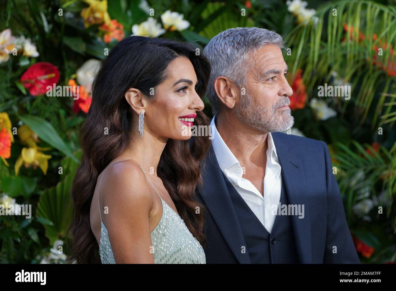 Amal Clooney, left, and George Clooney pose for photographers upon ...