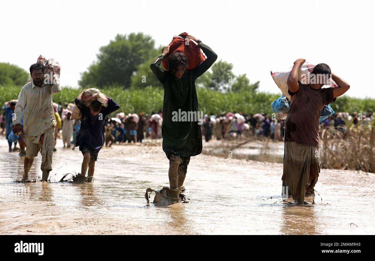 Victims of unprecedented flooding from monsoon rains receive relief aid ...