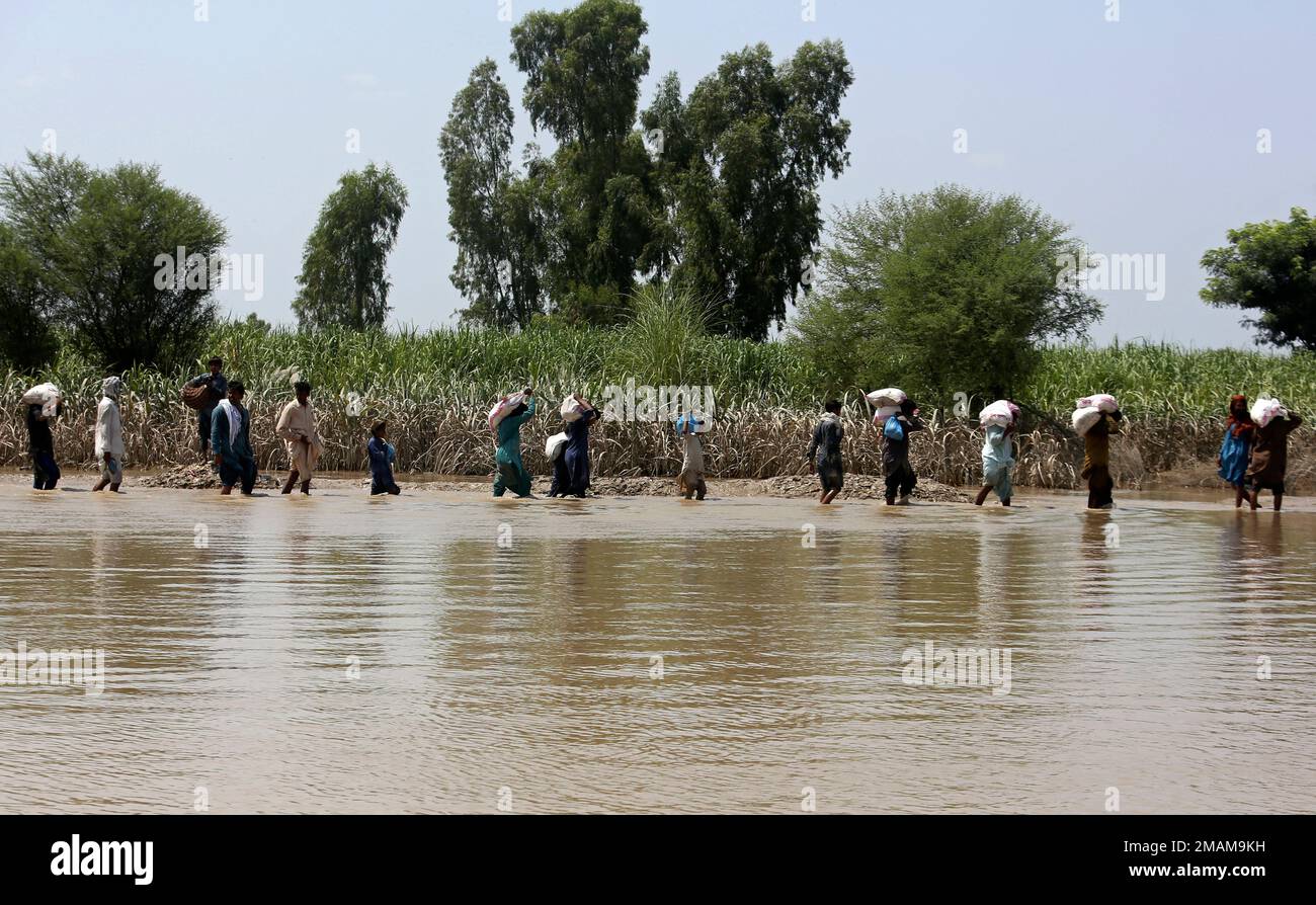 Victims of unprecedented flooding from monsoon rains receive relief aid ...