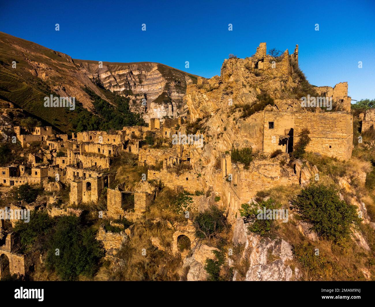Gamsutl, a view of an abandoned village on top of a mountain in ...
