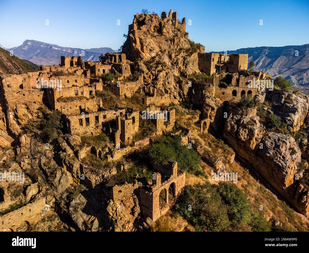 Gamsutl, a view of an abandoned village on top of a mountain in ...