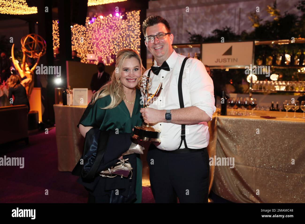 Amber Farrell, left, and Tim Farrell with the Emmy for outstanding ...