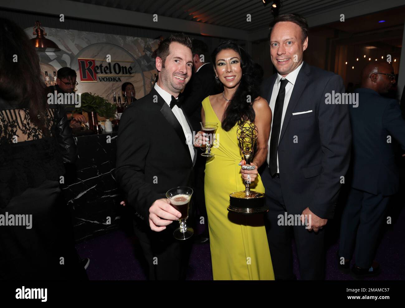 Ryan Goldberg, from left, Laura Montgomery with the award for ...