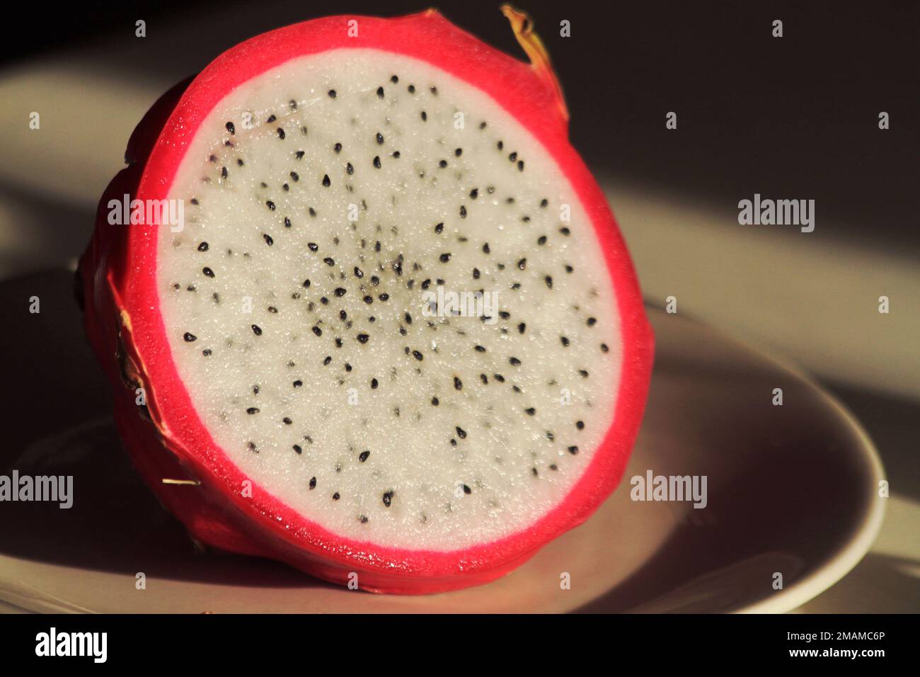 Dragon fruit cut cross-section Stock Photo - Alamy
