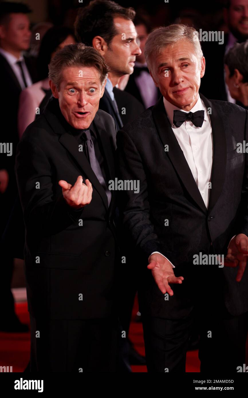 Willem Dafoe, left, and Christoph Waltz pose for photographers upon arrival at the premiere of ...