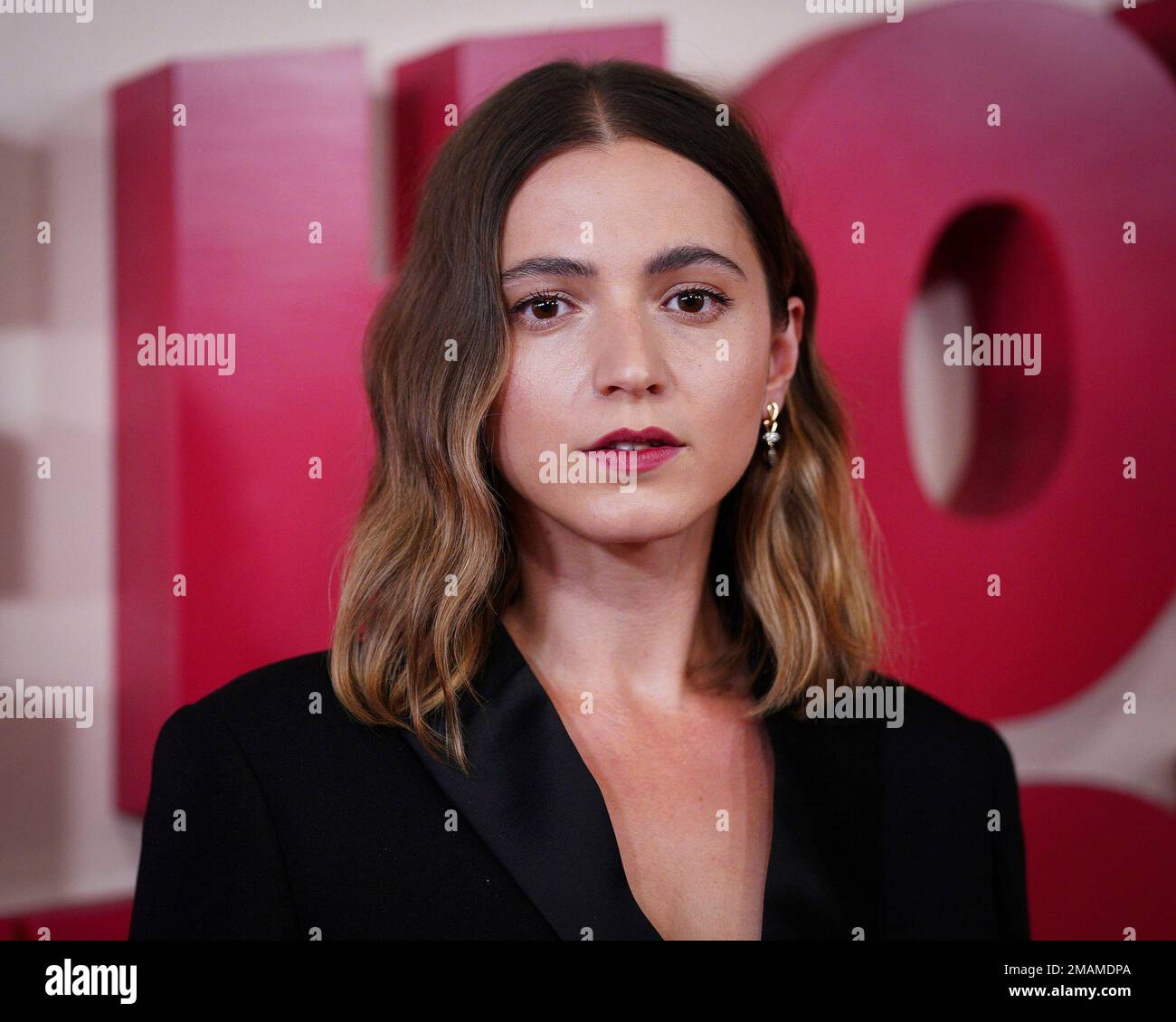 Pearl Chanda poses for photographers upon her arrival at the London ...