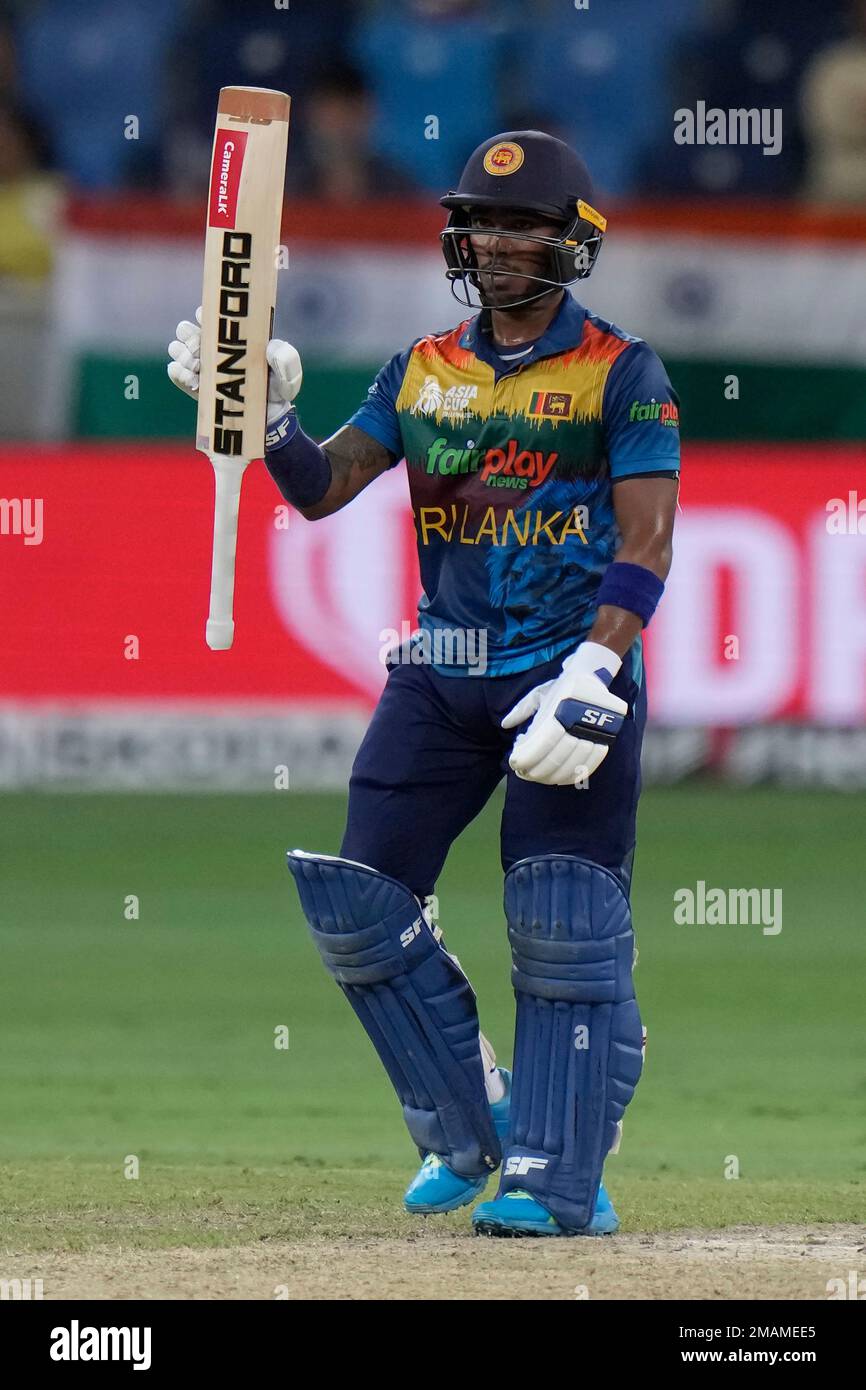Sri Lanka's Pathum Nissanka raises his bat to celebrate scoring fifty ...