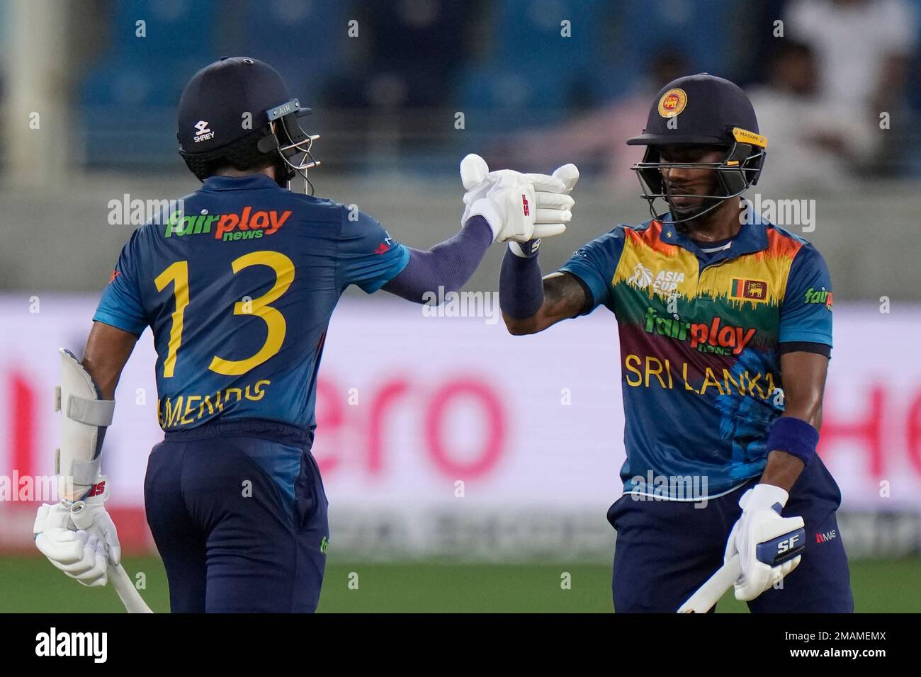 Sri Lanka's Pathum Nissanka, right, celebrates scoring runs with ...