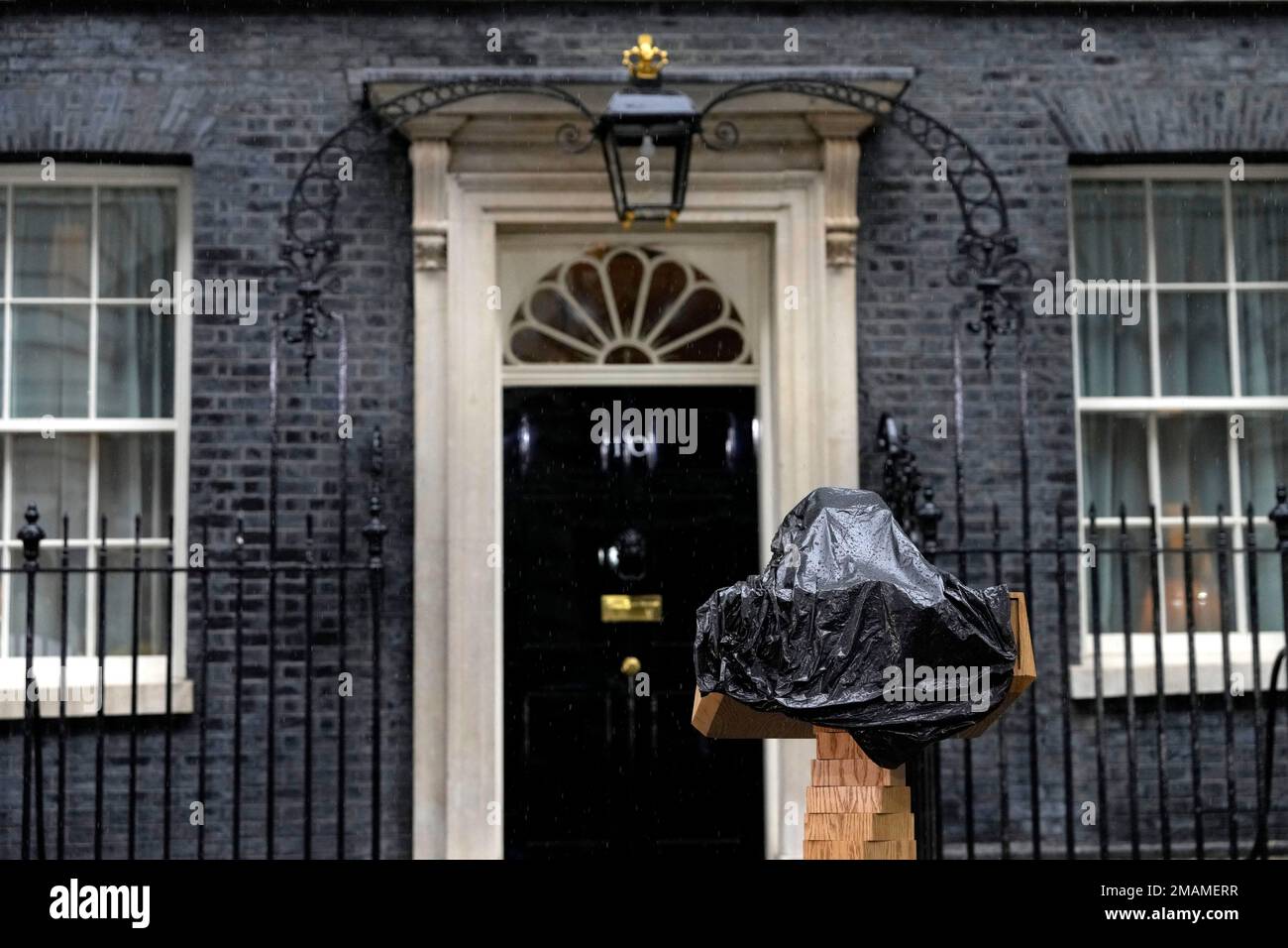 The microphones are covered with a plastic bag during a rainfall ...